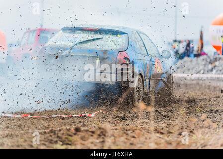 Wreck scrap cars dirt race. Selective focus on splashing mud Stock ...