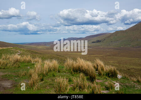 Vast treeless landscape in Scottish highlands with stream snaking ...