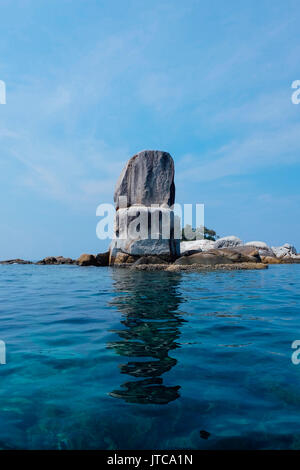 Shot photo of rocks and sea blue waves Stock Photo - Alamy
