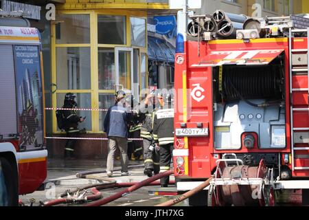 Firefighters work to extinguish a fire that broke out at a commercial ...