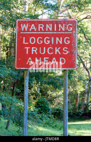 Warning: Logging trucks ahead sign Stock Photo - Alamy