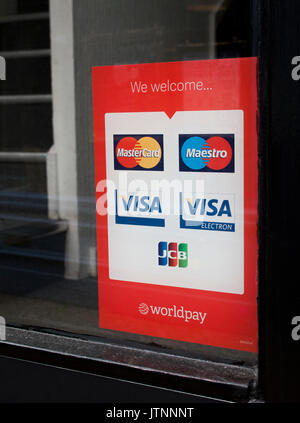 Worldpay we welcome various payment methods sign in retail shop window ...