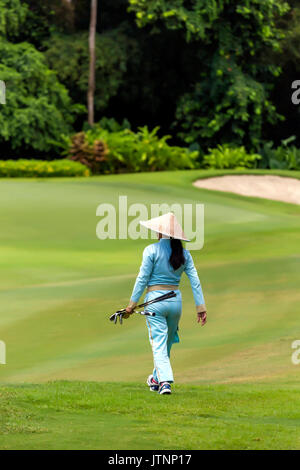Asian golf caddy, Bali, Indonesia Stock Photo - Alamy