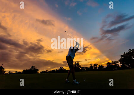 Golf player at sunset time,Bali,Indonesia Stock Photo - Alamy