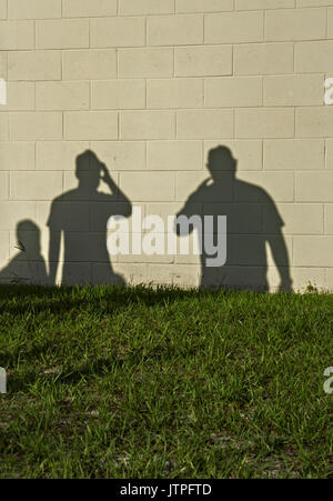A person's shadow is cast on a wall at an exposition by Venezuelan ...