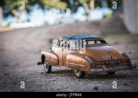 Ancient car marks favors parked in the field, car to scale, classic ...