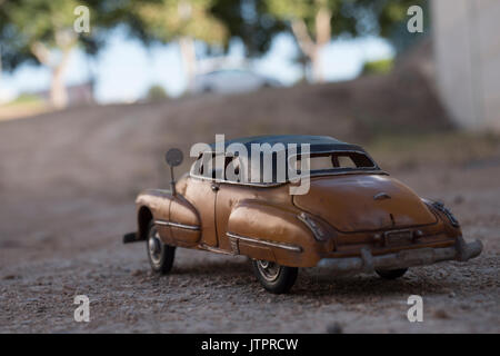 Ancient car marks favors parked in the field, car to scale, classic ...