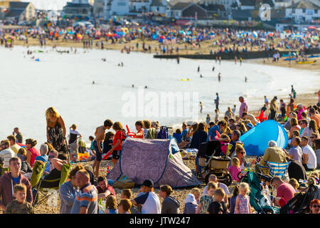 Lyme Regis, Dorset, UK. 10th July 2018. UK Weather. Sunbathers on the ...