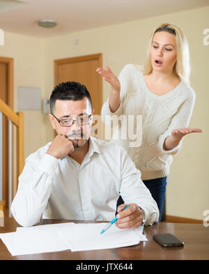 Quarrel in the family due to lack of money Stock Photo - Alamy