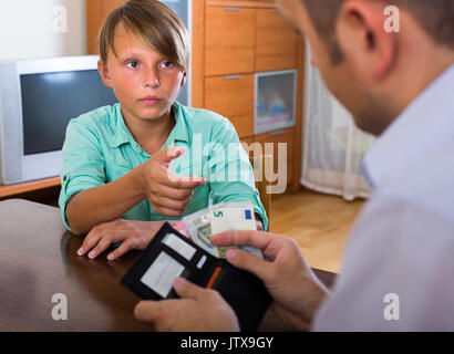 Boy asking father for small pocket money at home Stock Photo - Alamy