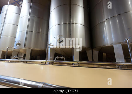 contemporary stell barrels in winery factory Stock Photo - Alamy