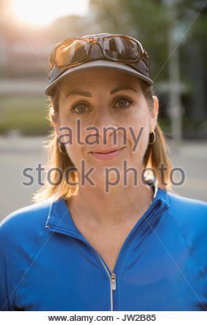 Portrait of female runner wearing baseball cap Stock Photo - Alamy
