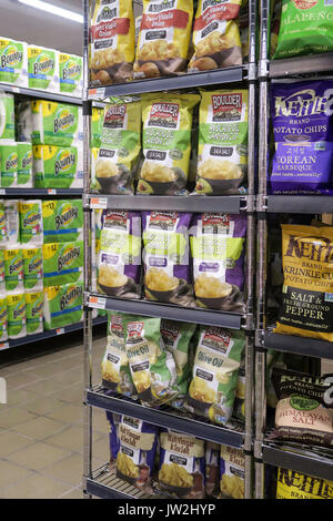 Grocery store chips & snacks aisle. Various brands, flavors, and sizes ...