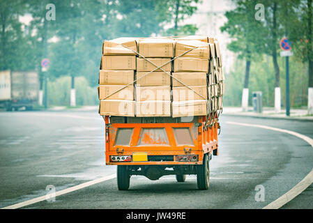 Small freight car with cardboard boxes. China Stock Photo - Alamy