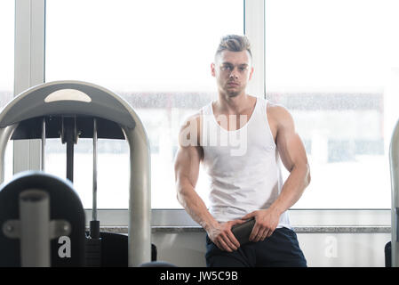 Muscular Man Resting After Exercise And Drinking From Shaker Stock ...