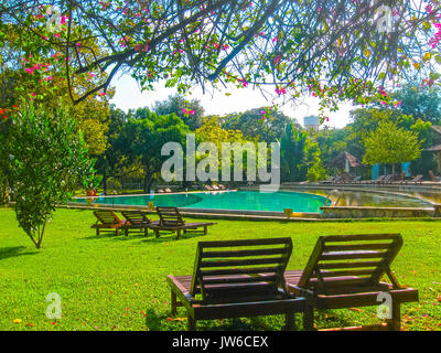Dambulla, Sri Lanka - May 1, 2009: Swimming pool of hotel Chaya Village ...