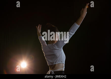 Rear view of ballerina practicing ballet dance on the stage Stock Photo ...