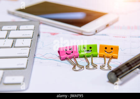 Smile paper clips, keyboard, pen, tablet and documents Stock Photo - Alamy