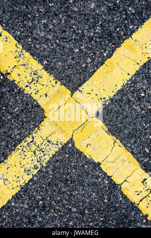 Painted yellow cross, road markings Stock Photo - Alamy