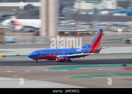 A Boeing 737-700 with regional airline, Air Do takes off behind the ...