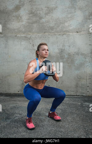 fit girl doing squats in the gym Stock Photo - Alamy