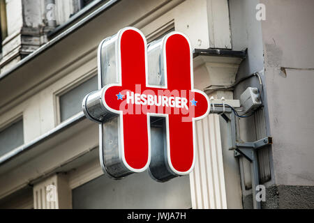 Hesburger logo sign in Riga, Latvia. Hesburger is a fast-food chain ...