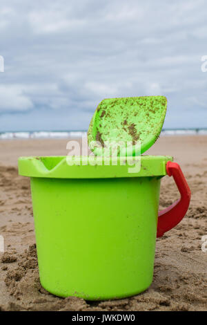 Small spade in bucket Stock Photo - Alamy