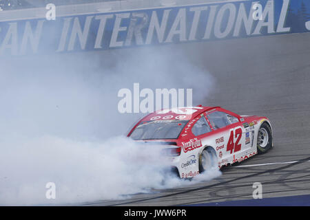 Kyle Larson does a burnout after winning a NASCAR Cup Series auto race ...