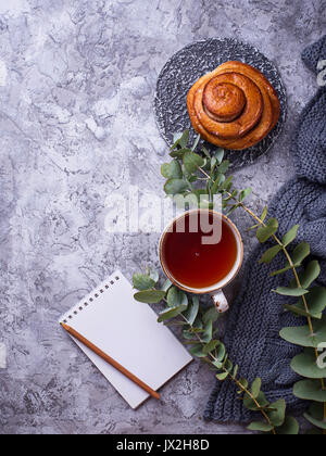 A cup of tea and empty notebook for sketch Stock Photo - Alamy