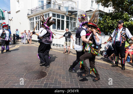 Traditional folk dancers, Dead Horse Morris, dancing in small public ...
