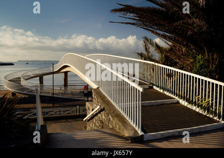 Spiral footbridge over the seafront road, overlooking Tor Bay Stock ...