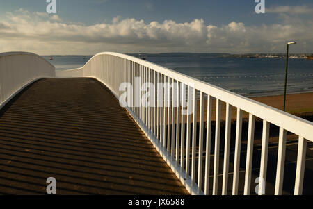 Spiral footbridge over the seafront road, overlooking Tor Bay Stock ...