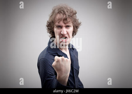 angry man trying to intimidate you with a gross menace with both his ...