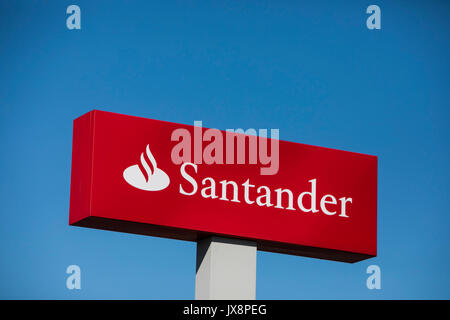 A logo sign outside of a Santander Bank branch in Camp Hill ...