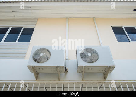 Air conditioner compressor unit hanging on the wall, outdoor Stock ...