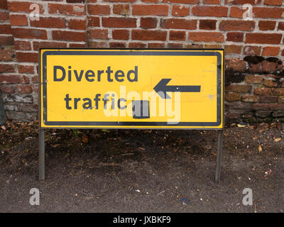 A temporary diversion sign at road works on a London street Stock Photo ...