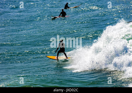 Brazilian man surfing on Copacabana Beach in Rio de Janeiro in Brazil ...
