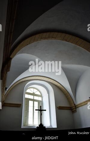 Curving stained glass shapes in red, blue and green within the takhrim ...