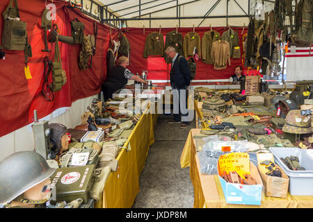 WW2 collector buying Second World War military memorabilia from stand ...