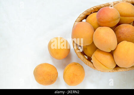A few light yellow organic, ripe, juicy, sweet pears on a wooden chip ...
