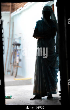 INDIA Uttar Pradesh , dalit women in village in Bundelkhand, woman carry cow dung on the head ...