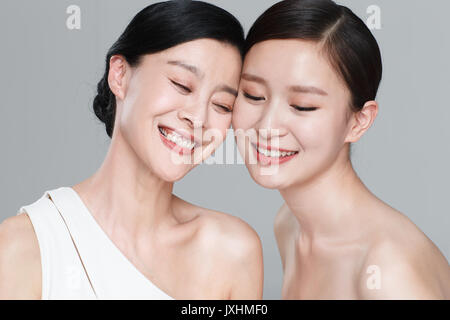 Horizontal shot of two Asian beautiful females meeting with their tutor ...