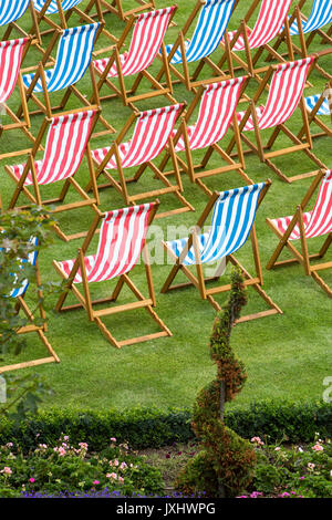 Rows of blue deck chairs Stock Photo - Alamy