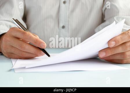 the hand of the man does entries in official papers Stock Photo - Alamy