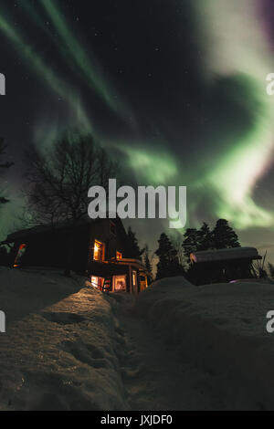 Frozen land in scandinavia and Aurora in the sky Stock Photo - Alamy