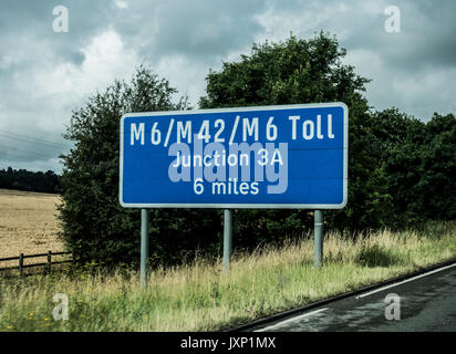 Blue sign on the M42 motorway for Birmingham, and also (heading ...