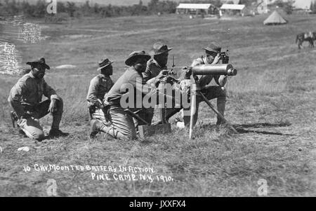 Military soldier crouching in grass in boot camp Stock Photo - Alamy