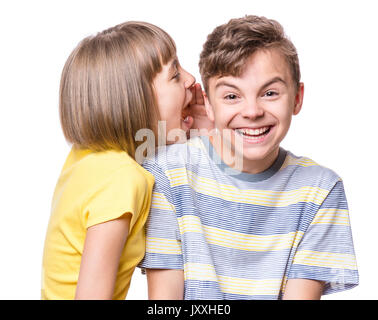 Little boy telling a secret to his sister Stock Photo - Alamy