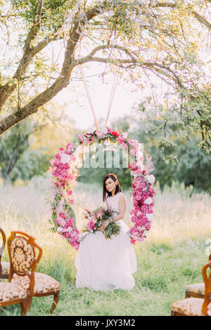Young rose flowers on a green defocused background. With space for text ...