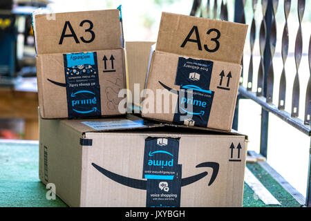Opened Amazon Prime boxes on a front porch Stock Photo - Alamy